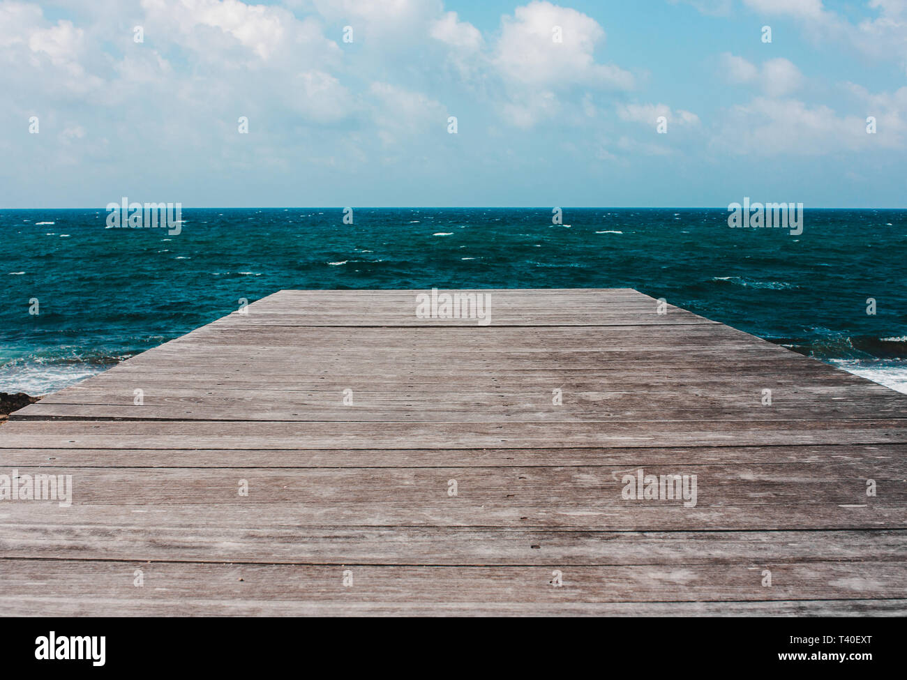 Wooden old bridge, pier, pier in the sea, ocean.Summer background with ...