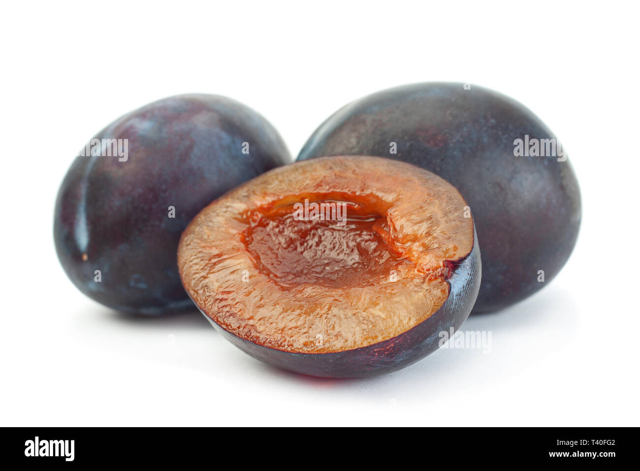 Blue plum fruit closeup isolated on white background Stock Photo - Alamy