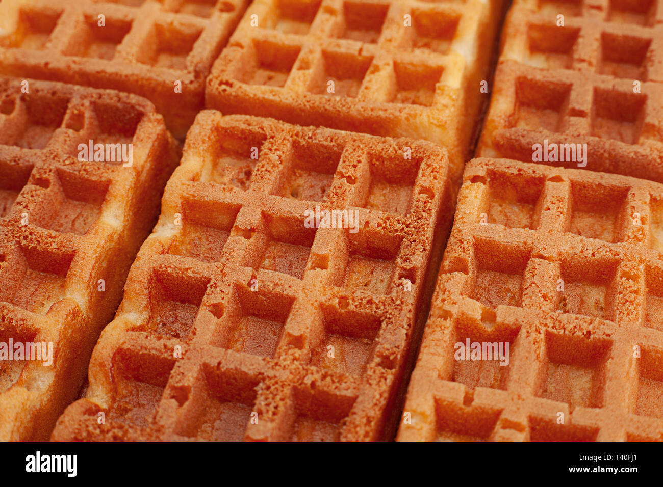 Belgian wafer sweet dessert closeup detail background Stock Photo - Alamy
