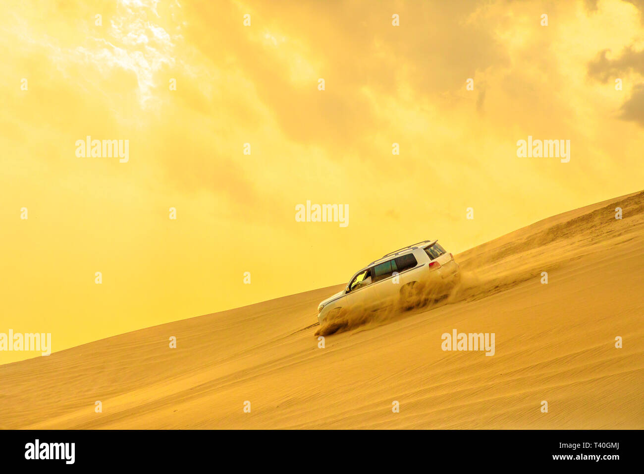 Dune Bashing at sunset sky near Qatar and Saudi Arabia. Khor Al Udeid ...