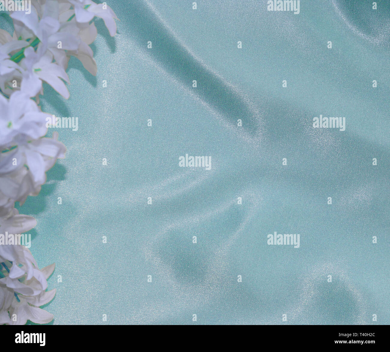 On the blue material is a flower. The texture of the blue material ...