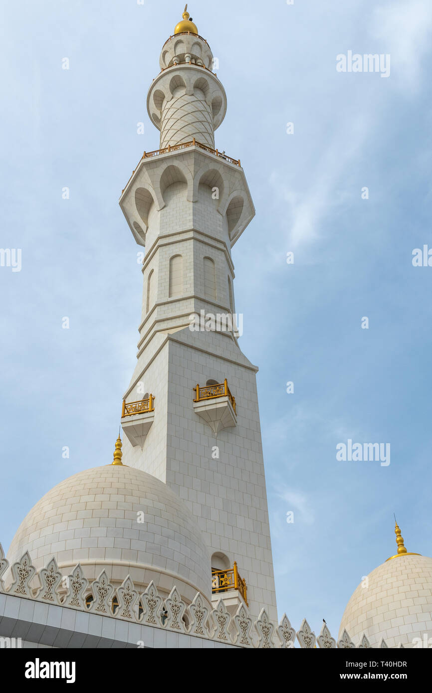 White minaret of mosque against the sky in Abu Dhabi, UAE Stock Photo ...