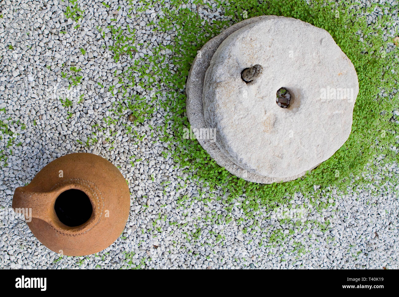 Traditional Greek and Cypriot stone mill and clay pot top view Stock ...