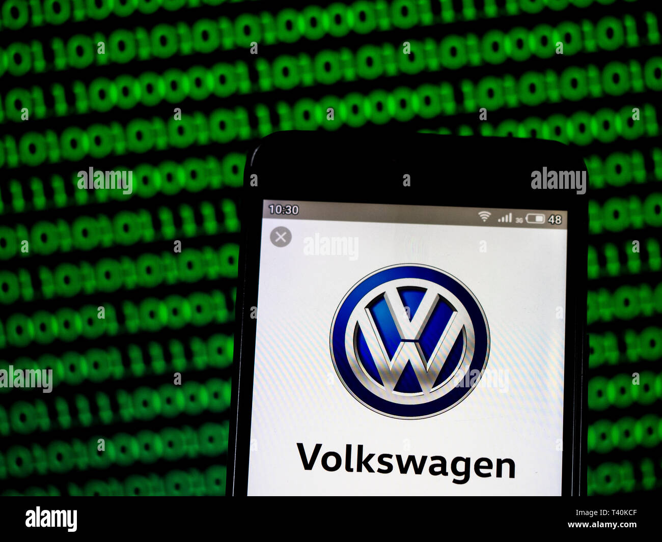 In this photo illustration a Volkswagen logo seen displayed on a smart ...