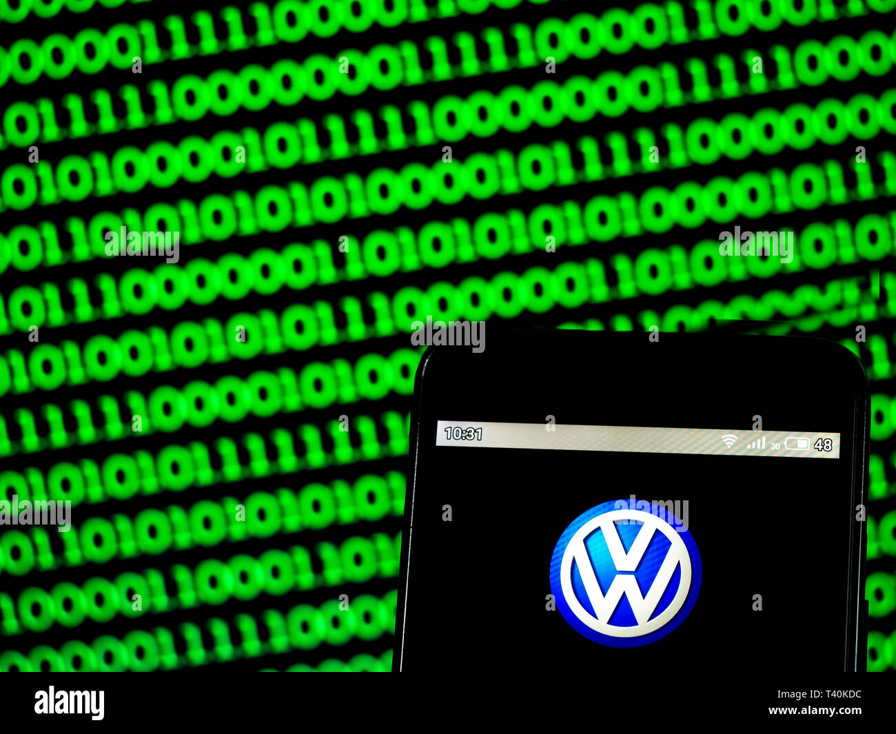 In this photo illustration a Volkswagen logo seen displayed on a smart ...
