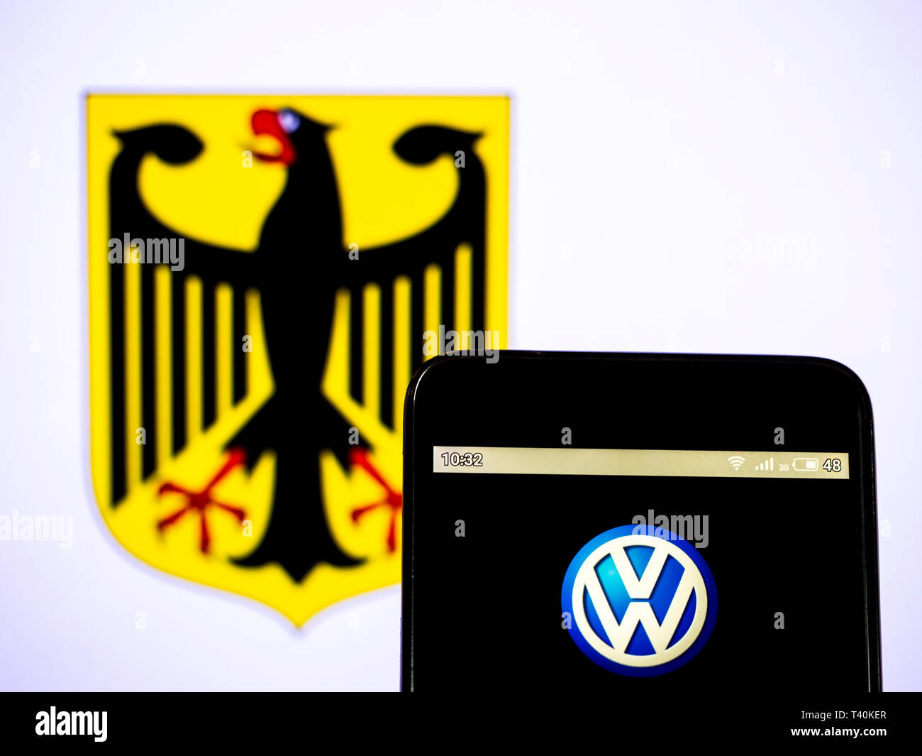 In this photo illustration a Volkswagen logo seen displayed on a smart ...