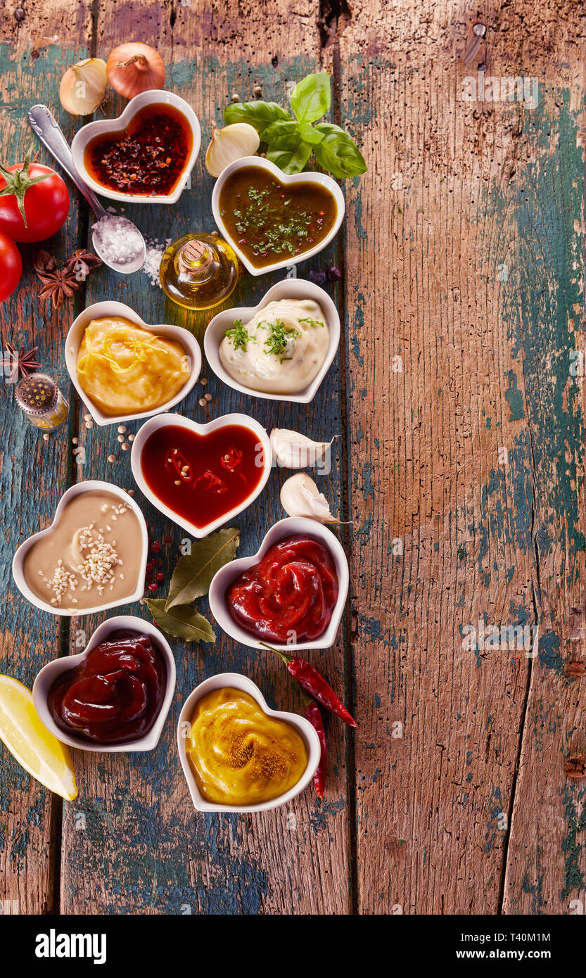 Overhead view of large assortment of sauces, dips and marinades in ...