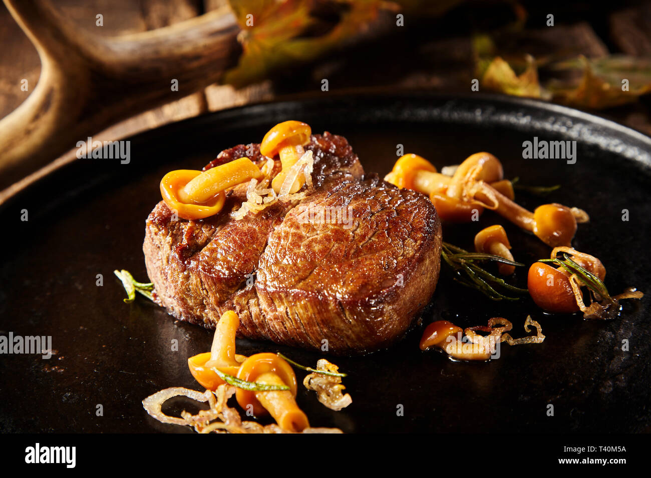 Thick portion of grilled wild venison deer steak with fried fall ...