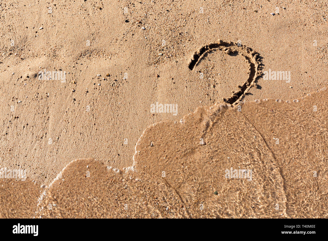 Question mark sign on sand beach near the sea. Concept of dilemma ...