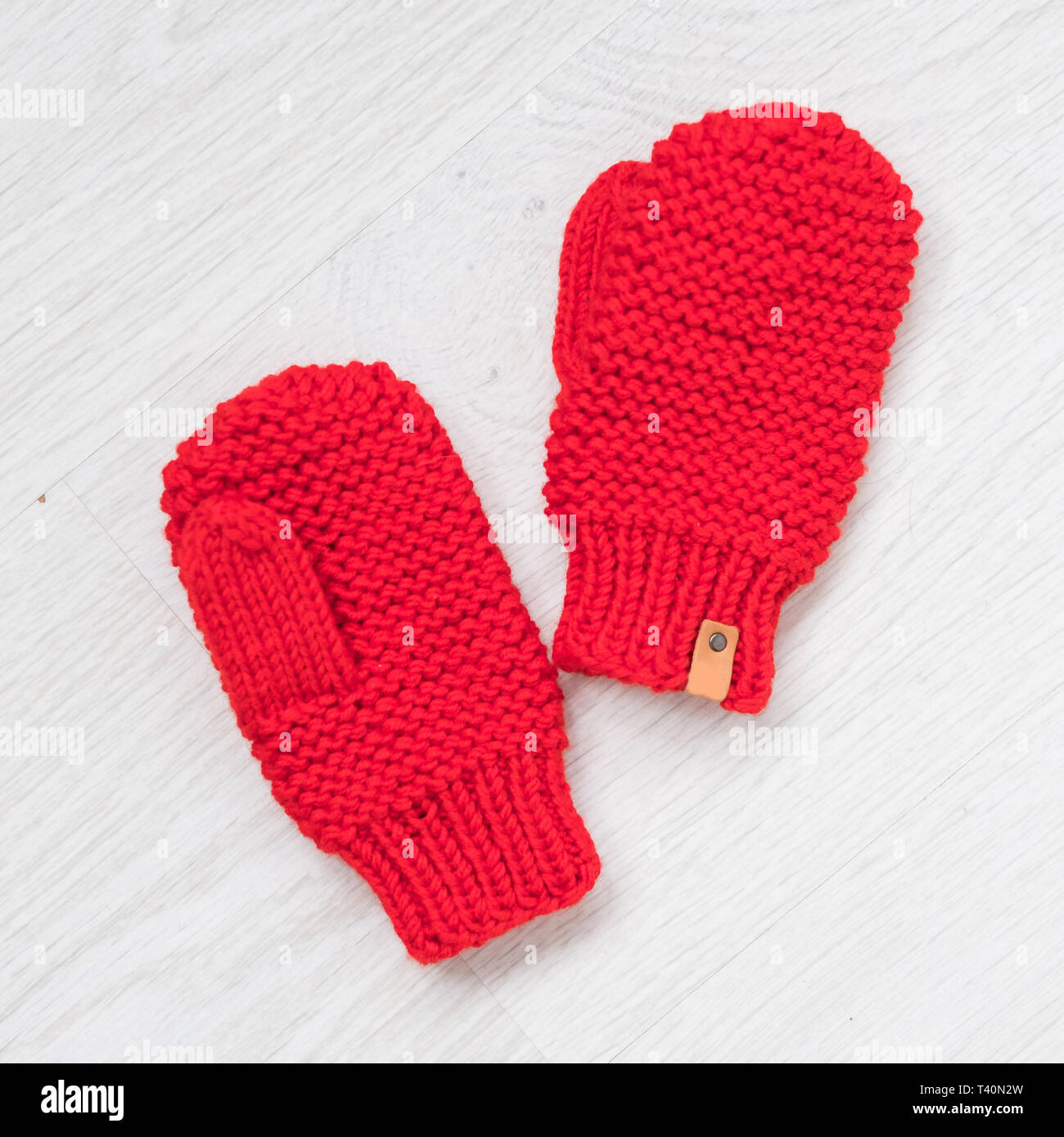cute cozy knitted children winter mittens Stock Photo - Alamy