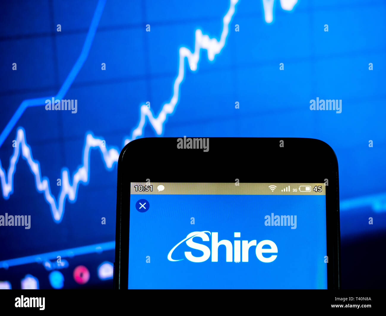 In this photo illustration a Shire Plc logo seen displayed on a smart ...