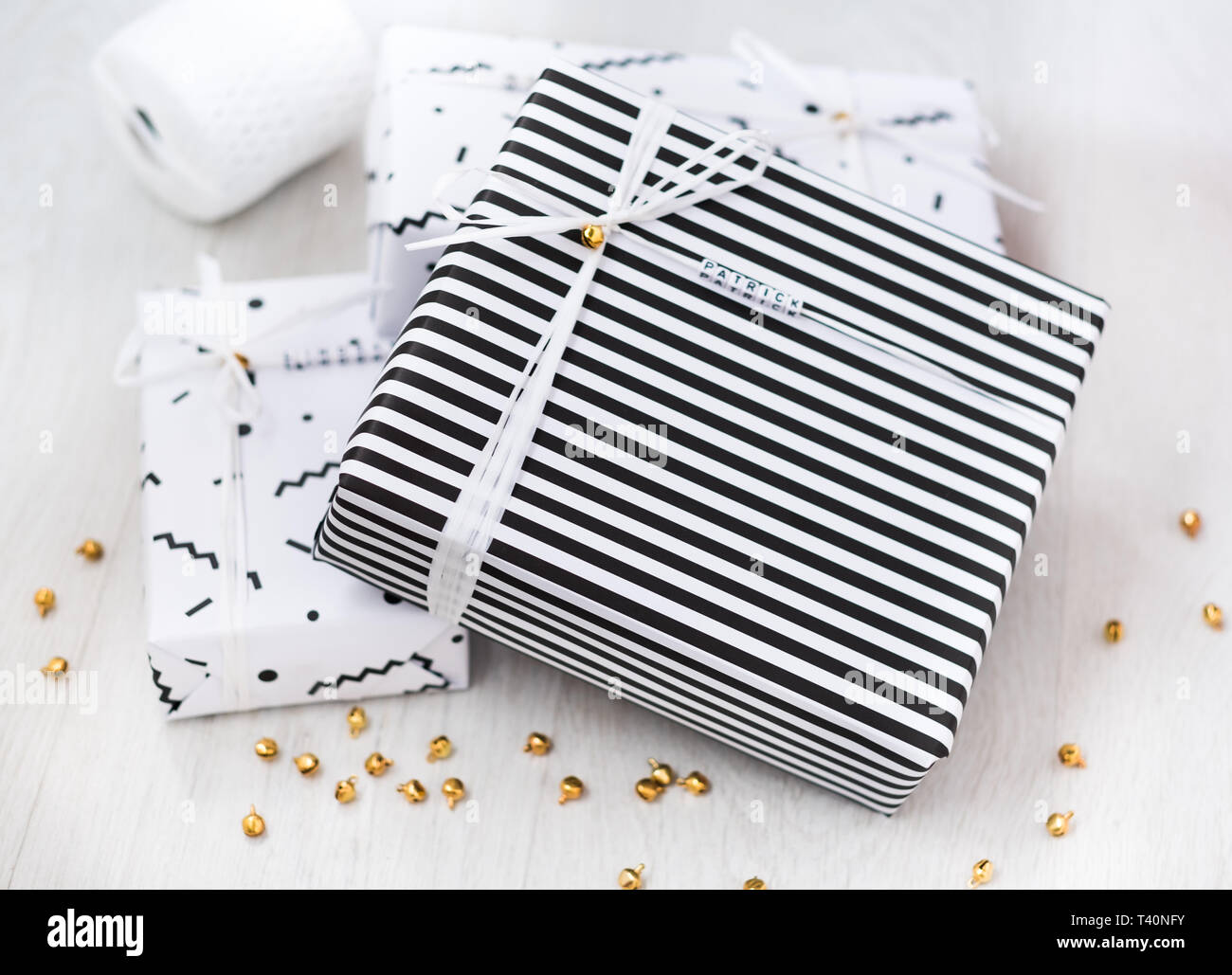 square boxes of different sizes wrapped gifts ribbons and ropes on the ...