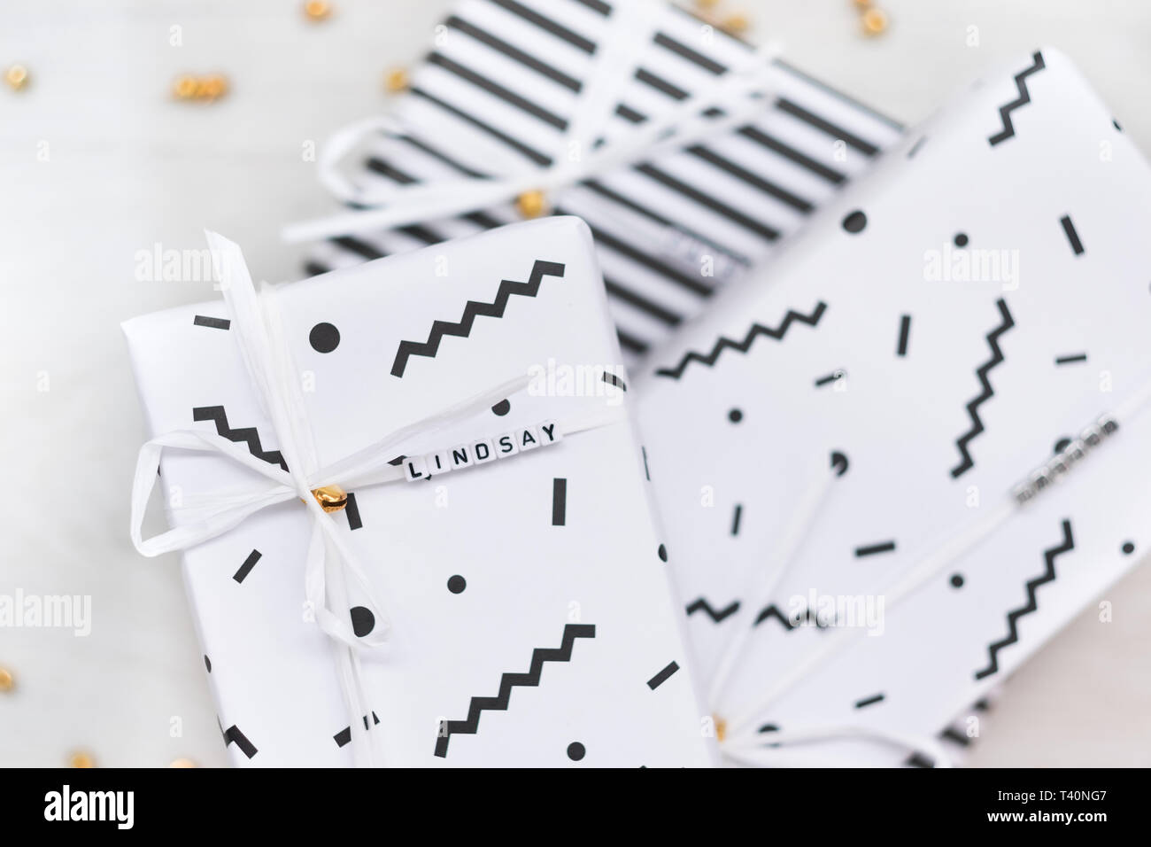 square boxes of different sizes wrapped gifts ribbons and ropes on the ...