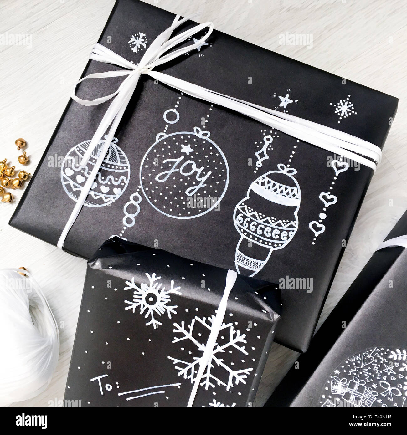 square boxes of different sizes wrapped gifts ribbons and ropes on the ...