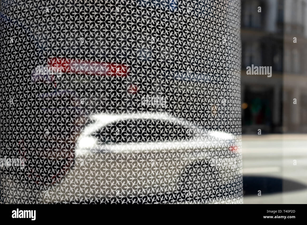 Abstract reflection of the car in the city in the glass showcase with ...