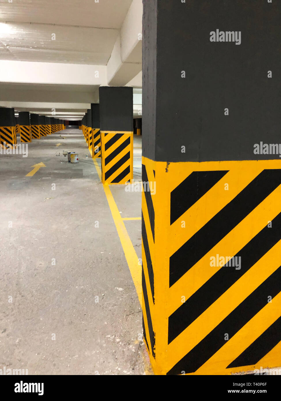 Photo of a potential danger diagonal stripes on a columns in a car park ...