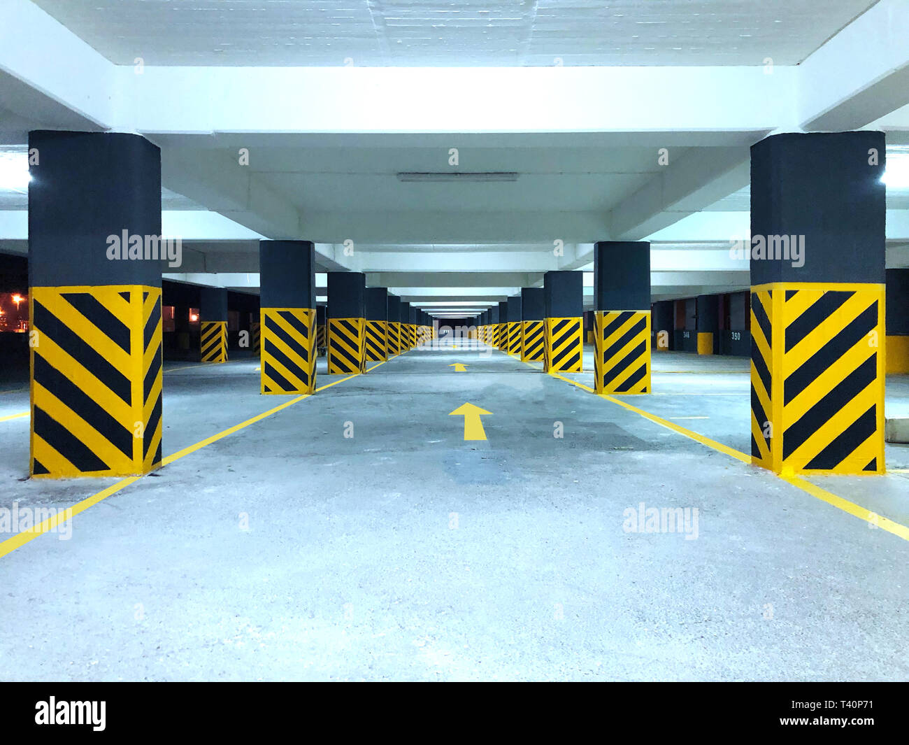 Perspective view of a Car park with yellow and black colored striped ...