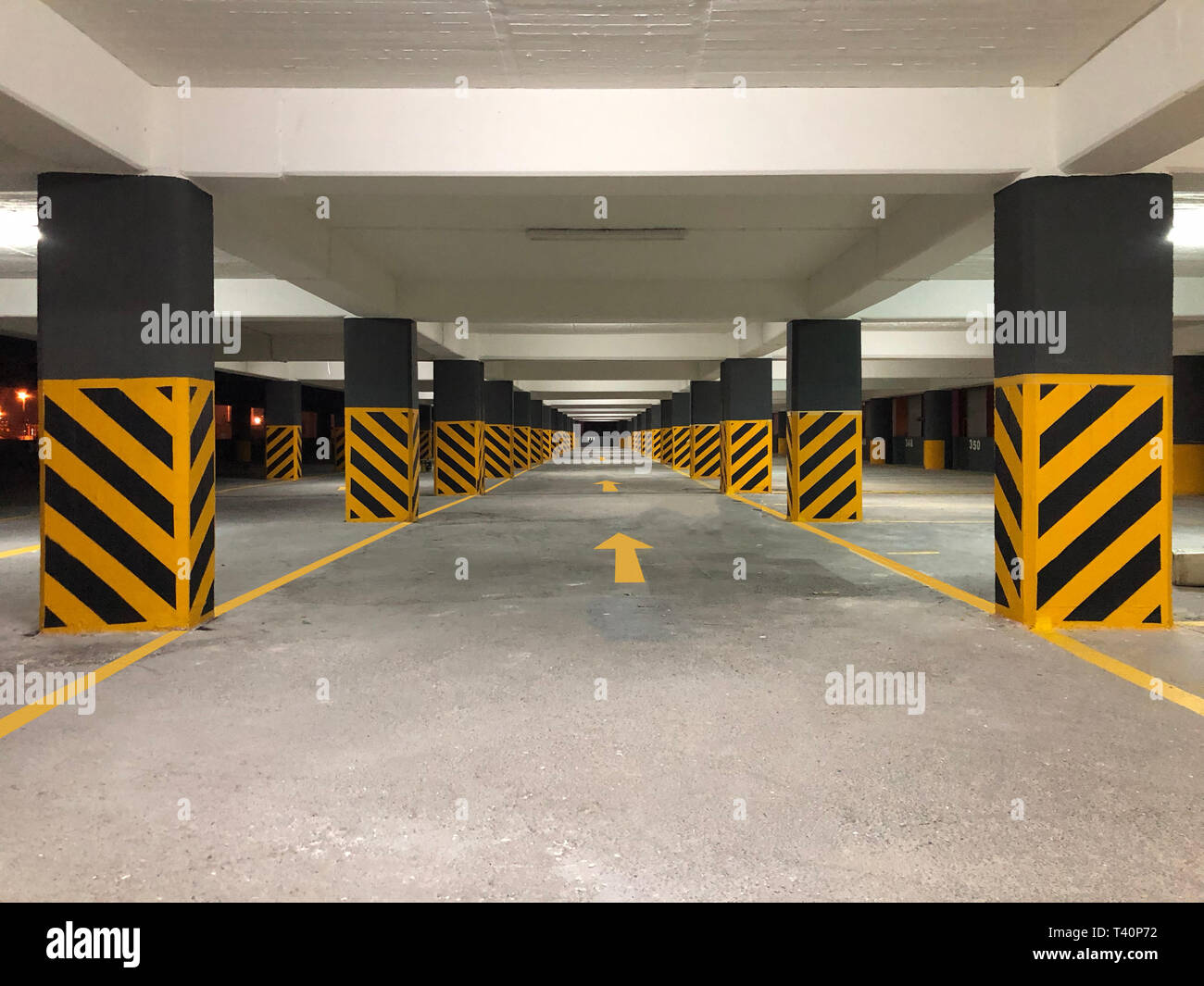 Perspective view of a Car park with yellow and black colored striped ...