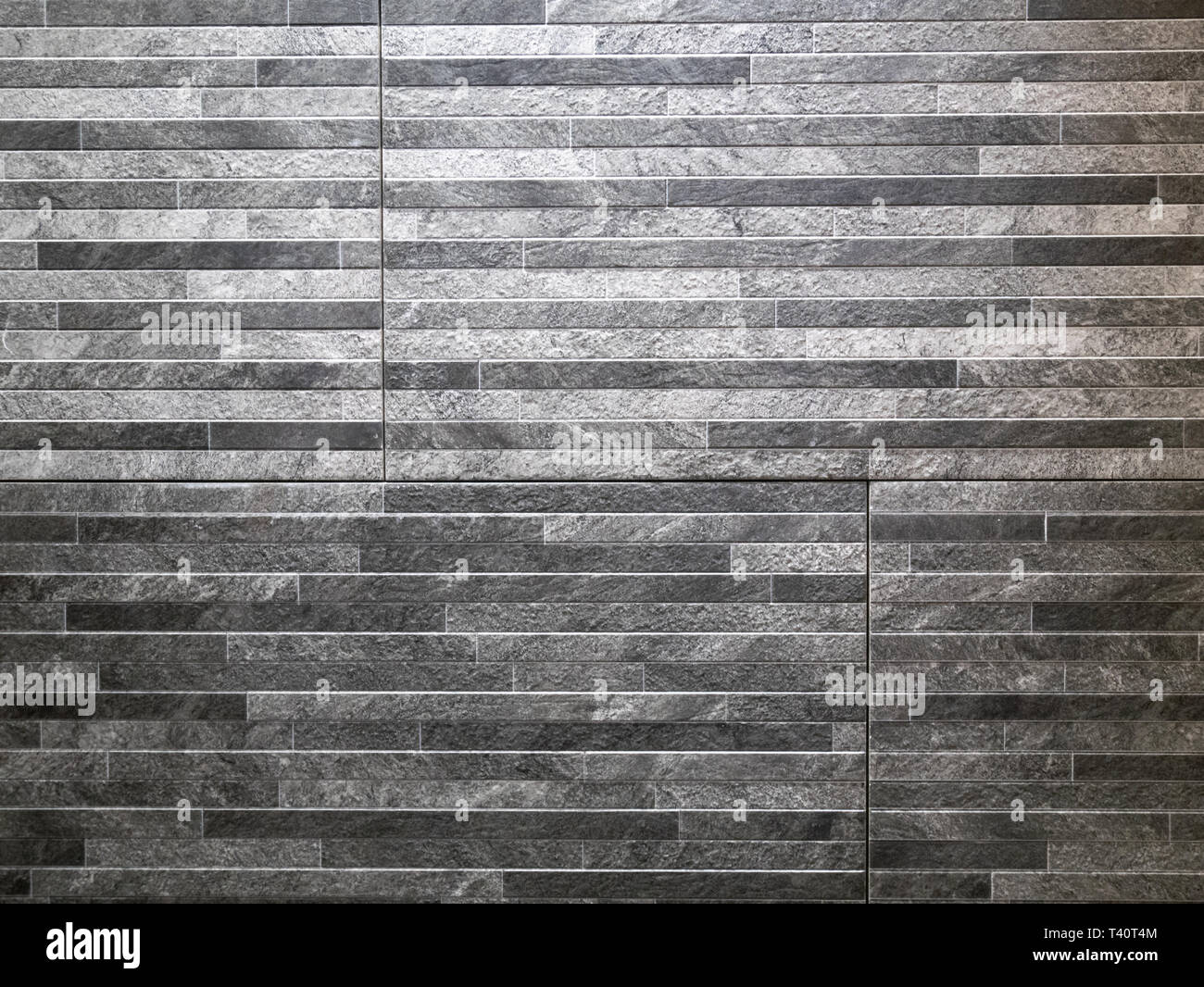 abstract pattern wall made of grey granite stones thin blocks bricks ...