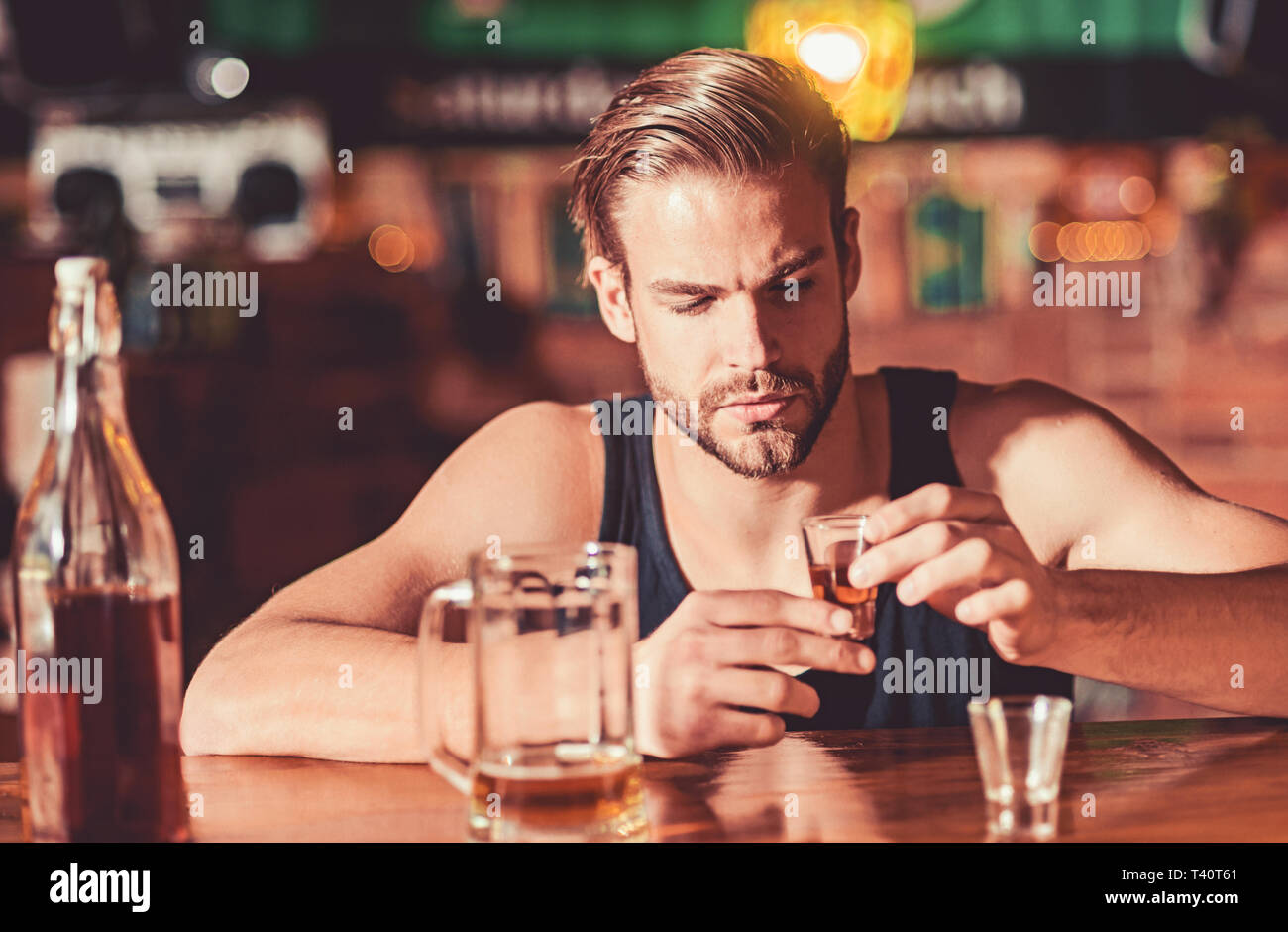 Heavy drinking is bad. Alcoholic man drinking at bar counter. Man drink ...