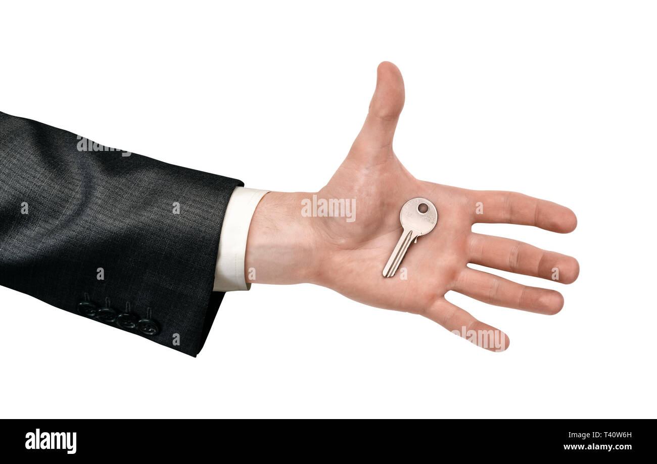 Close-up of man's hand in suit holding a key isolated on white ...