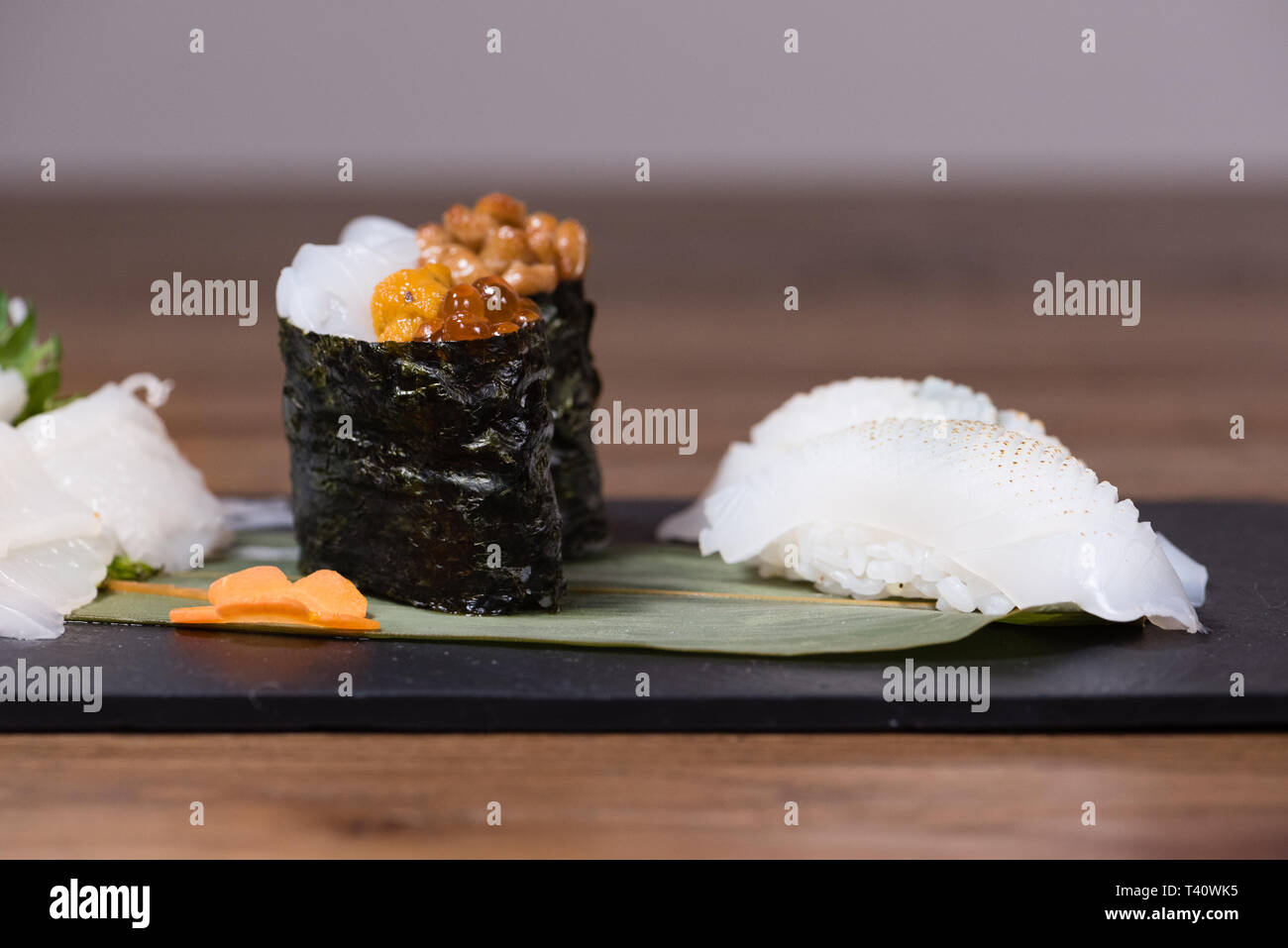 Plate composed of squid and cuttlefish sashimi, caviar and fermented ...