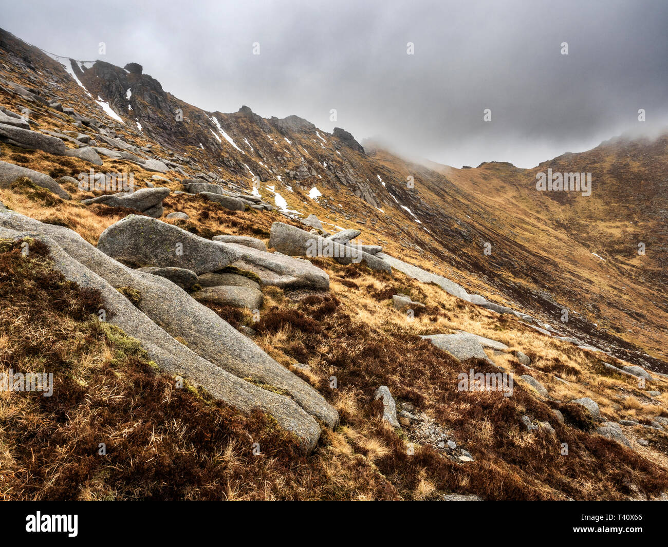 Clouds passing over buttresses near the summit of Goat Fell near ...