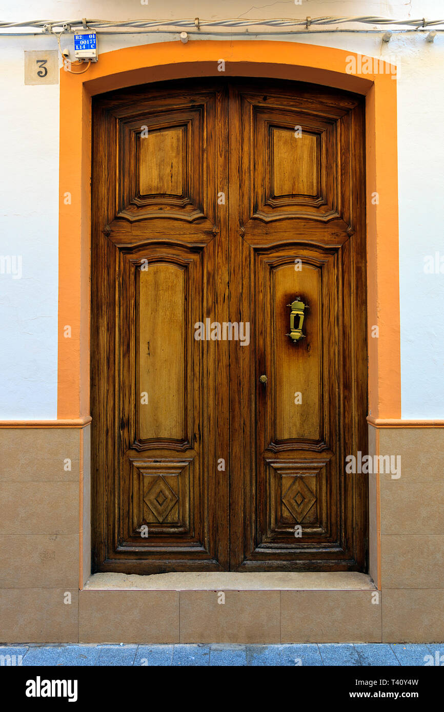 Spanish pair of ornate wood carved doors on house in Pego, Spain Stock ...