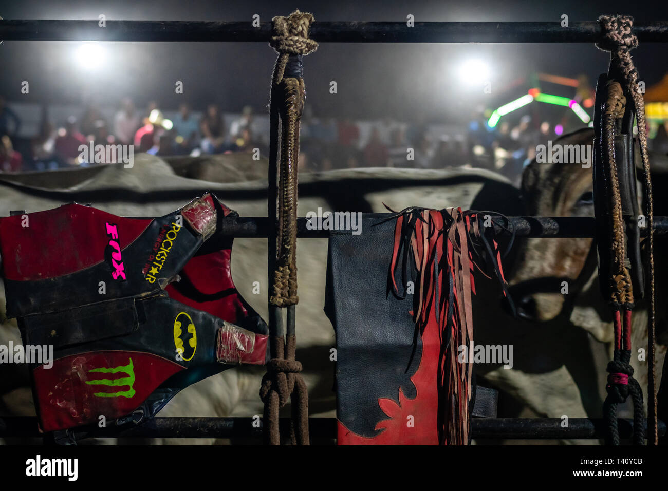 bull riding gear hanging on gate in Guatemalan rodeo Stock Photo - Alamy