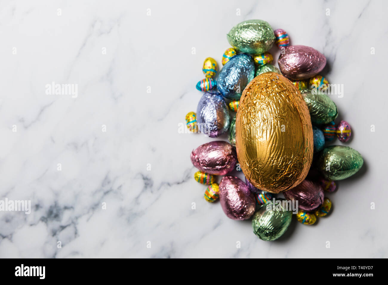 Easter egg chocolate treats wrapped in shiny coloured foil Stock Photo ...
