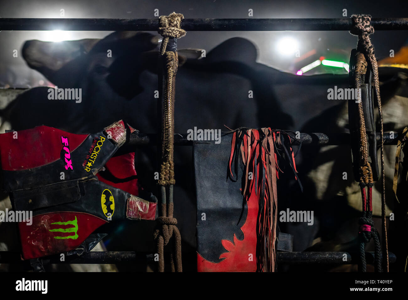 bull riding gear hanging on gate in Guatemalan rodeo Stock Photo - Alamy