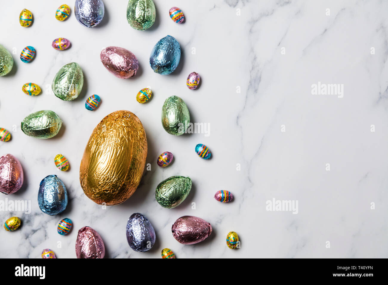 Easter egg chocolate treats wrapped in shiny coloured foil Stock Photo ...