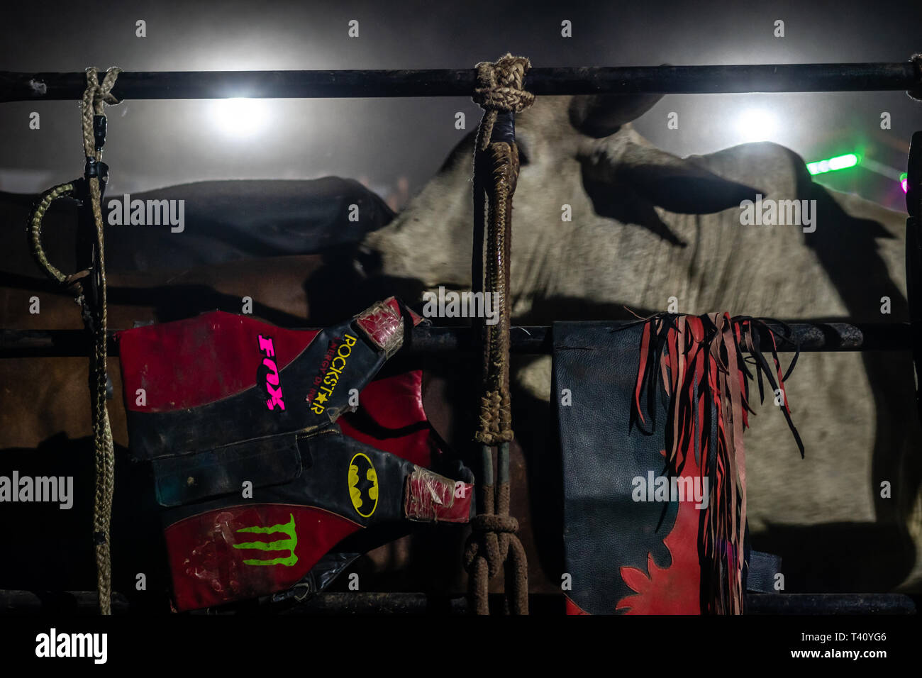 bull riding gear hanging on gate in Guatemalan rodeo Stock Photo - Alamy