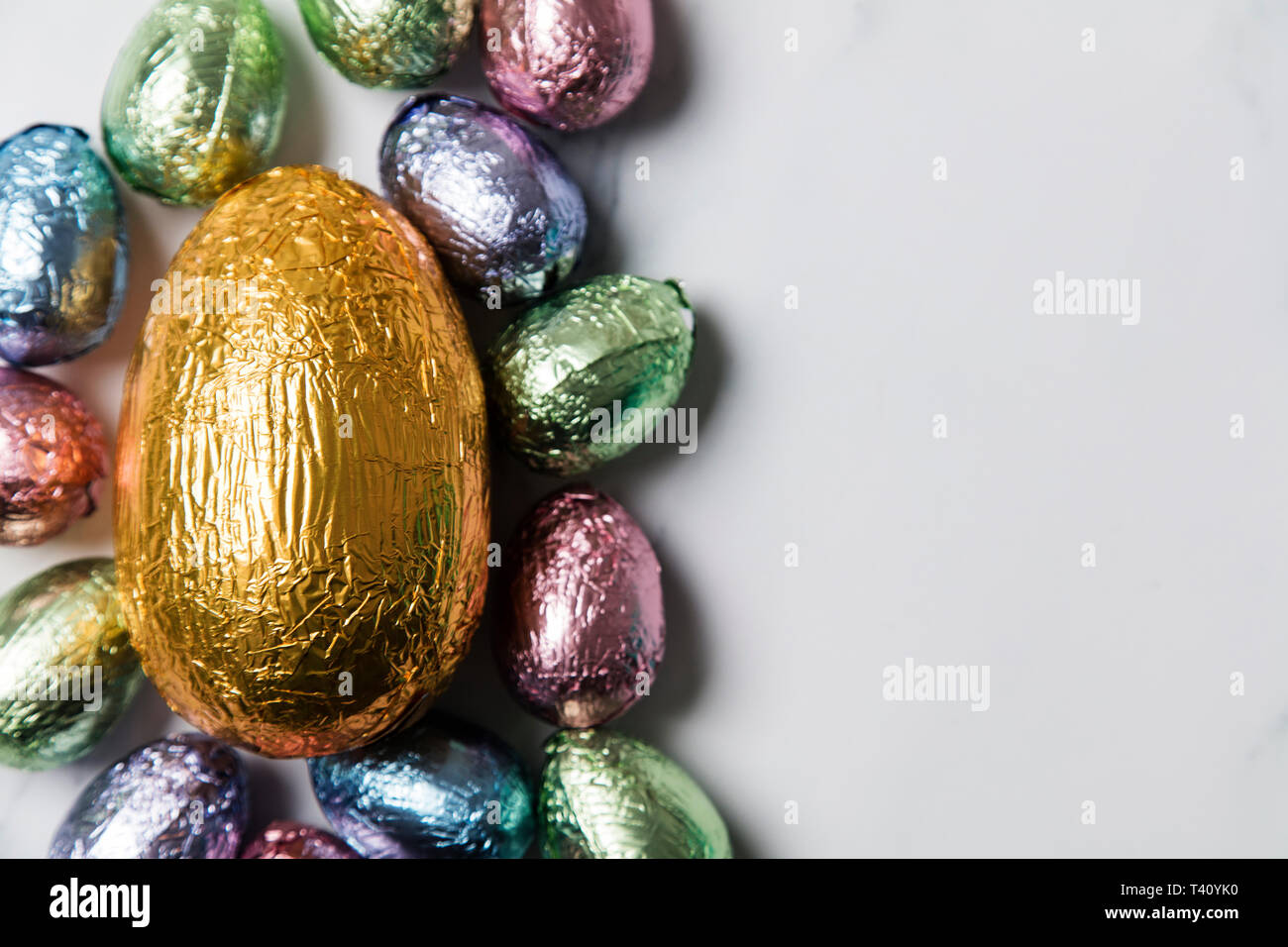 Easter egg chocolate treats wrapped in shiny coloured foil Stock Photo ...