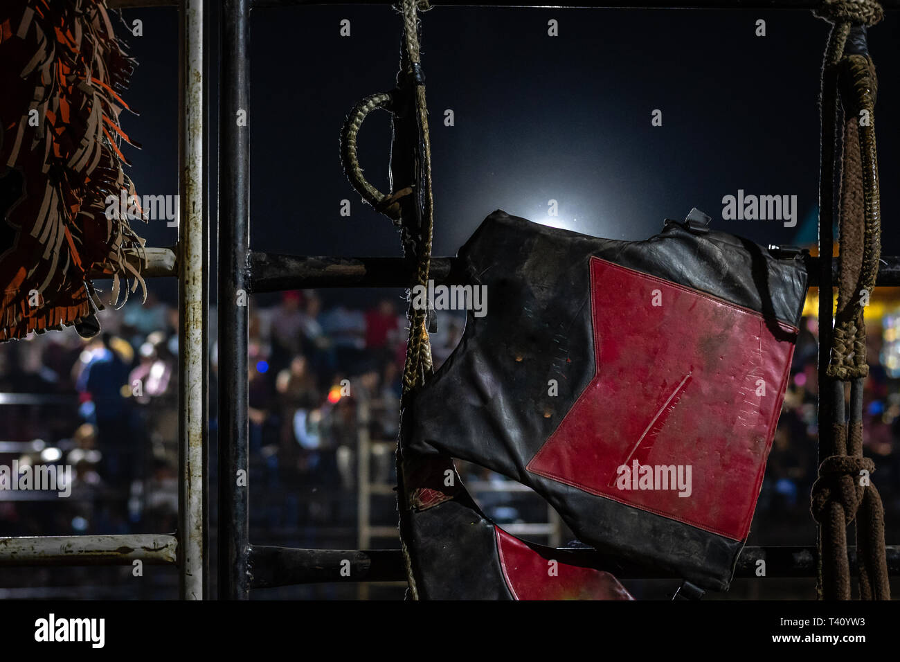 bull riding gear hanging on gate in Guatemalan rodeo Stock Photo - Alamy