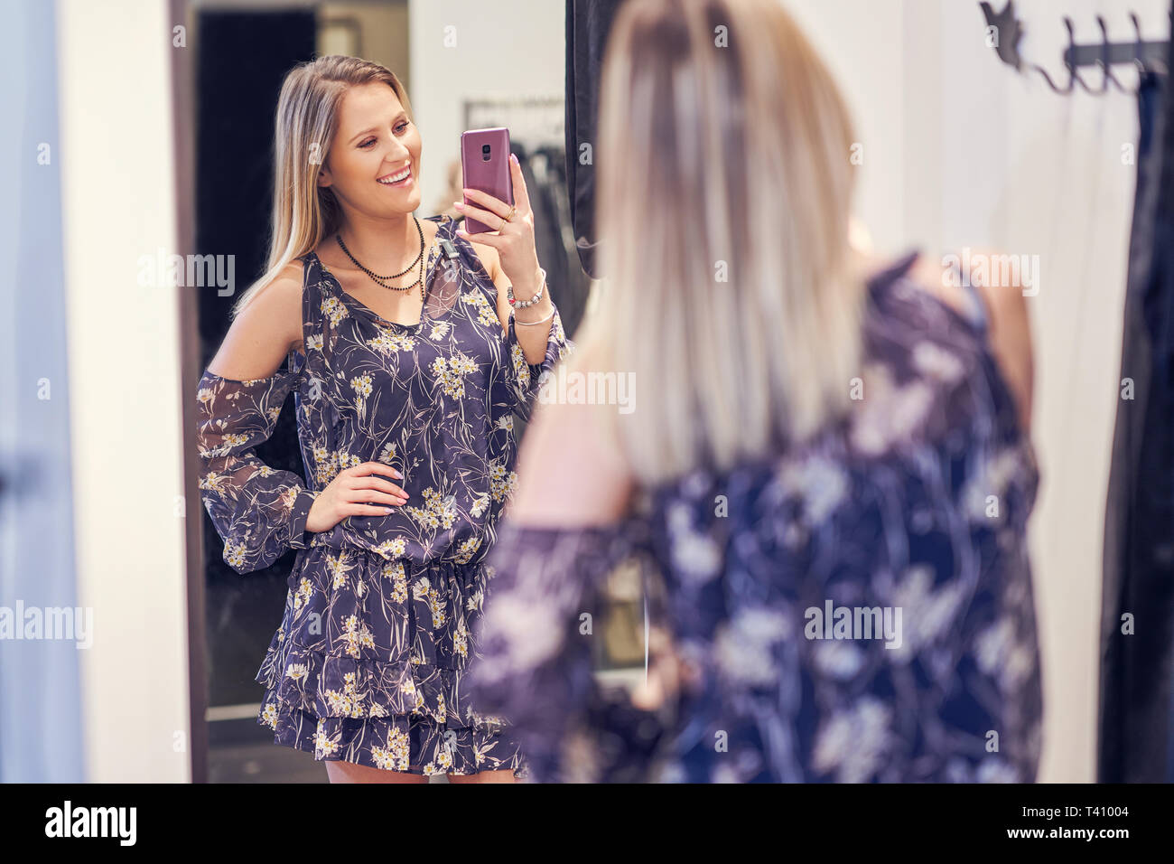 Picture of happy woman shopping for clothes in store Stock Photo - Alamy