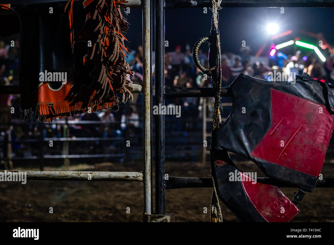 bull riding gear on gate in Guatemalan rodeo Stock Photo - Alamy