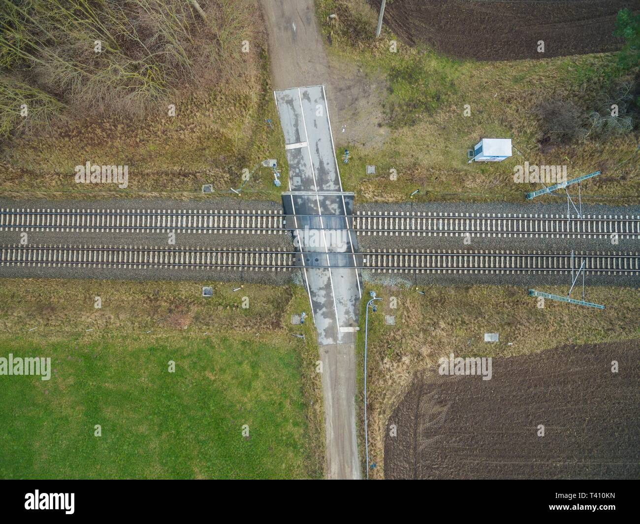 aerial view of railroad crossing on a railroad tracks in the ...