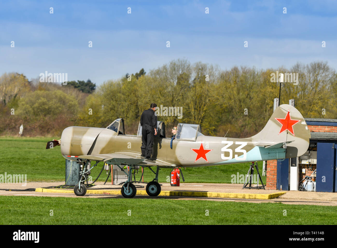 WHITE WALTHAM, ENGLAND - MARCH 2019: Person standing on the wing of a ...