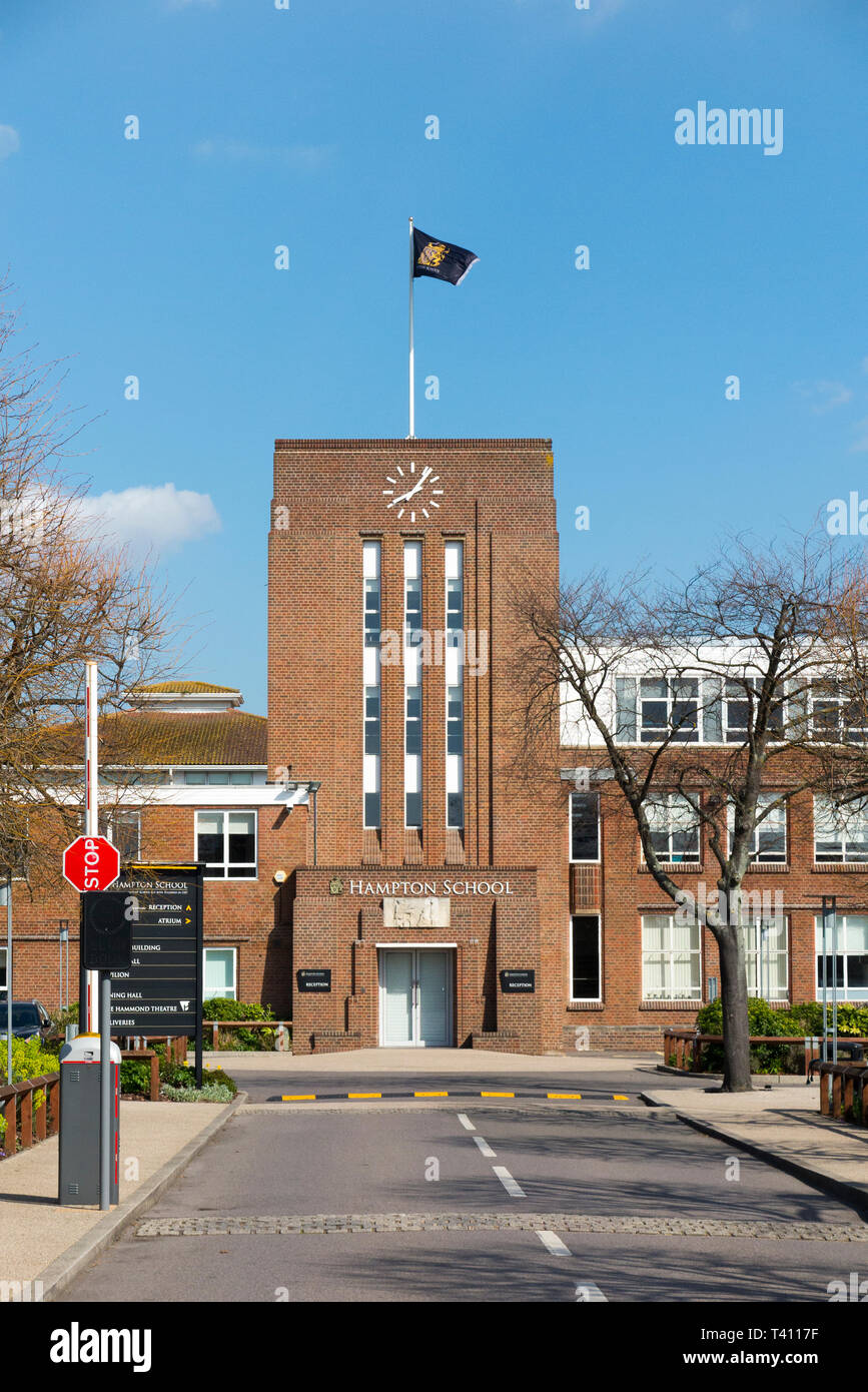 (Front exterior facade of Hampton School with flag flying. It is an ...