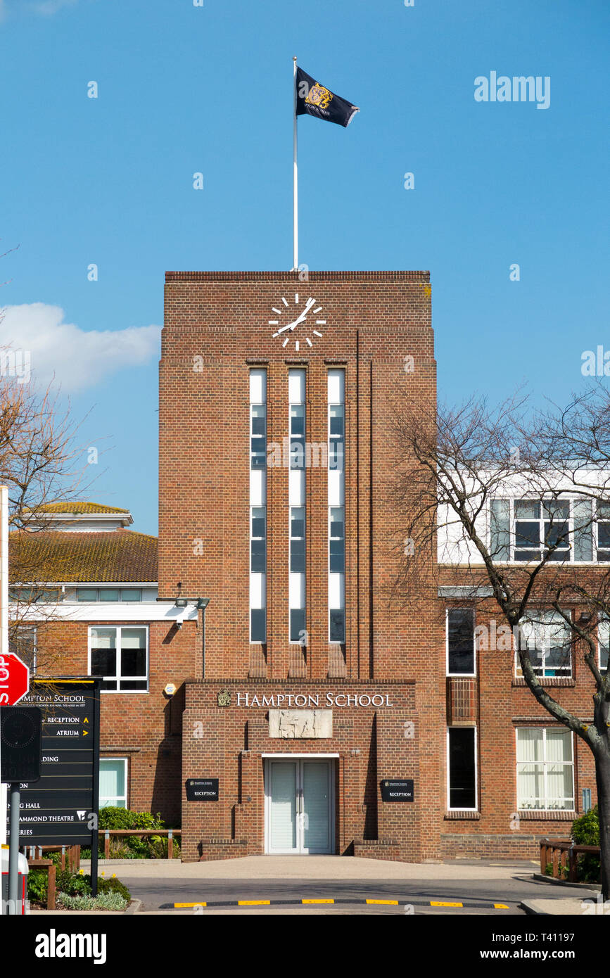 (Front exterior facade of Hampton School with flag flying. It is an ...