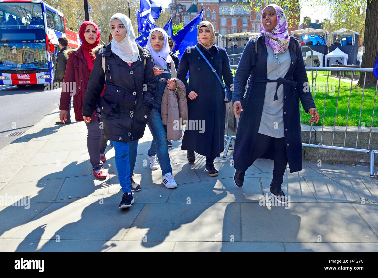 London, England, UK. Muslim women in headscarves passing College Green ...
