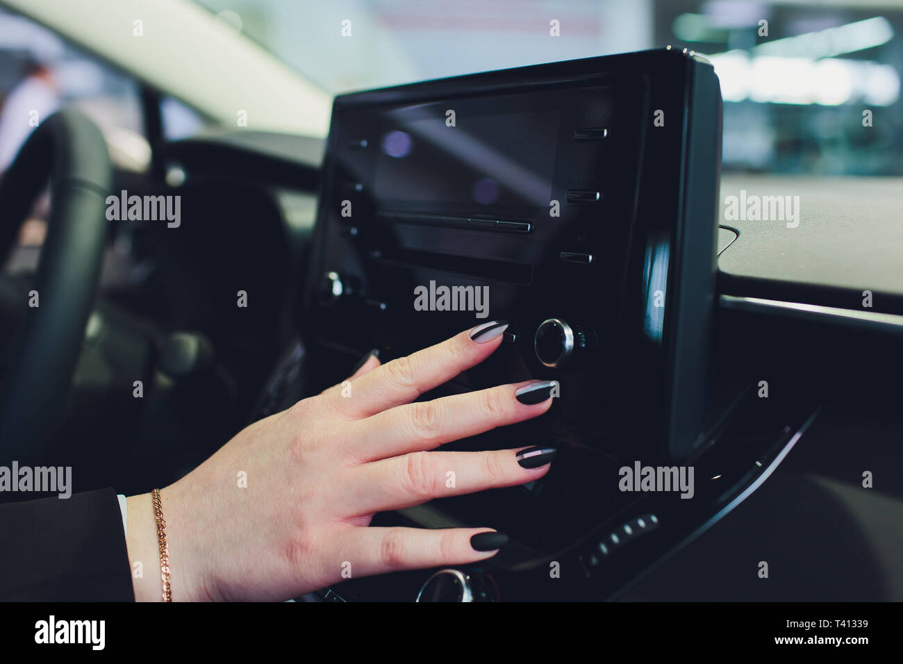 Transportation,technology and vehicle concept - man using car system ...