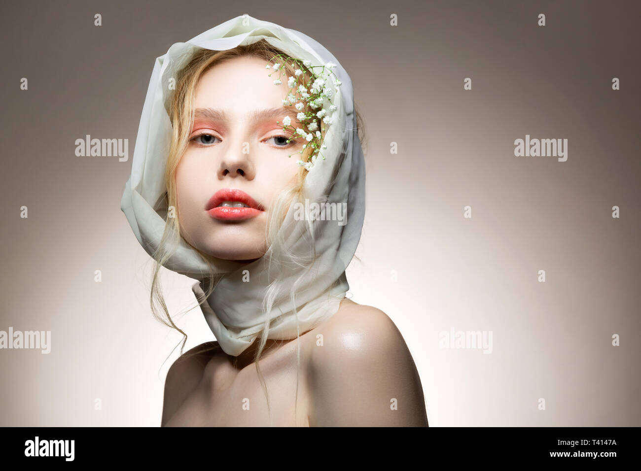 Model with amazing tender makeup posing with flowers in hair Stock ...