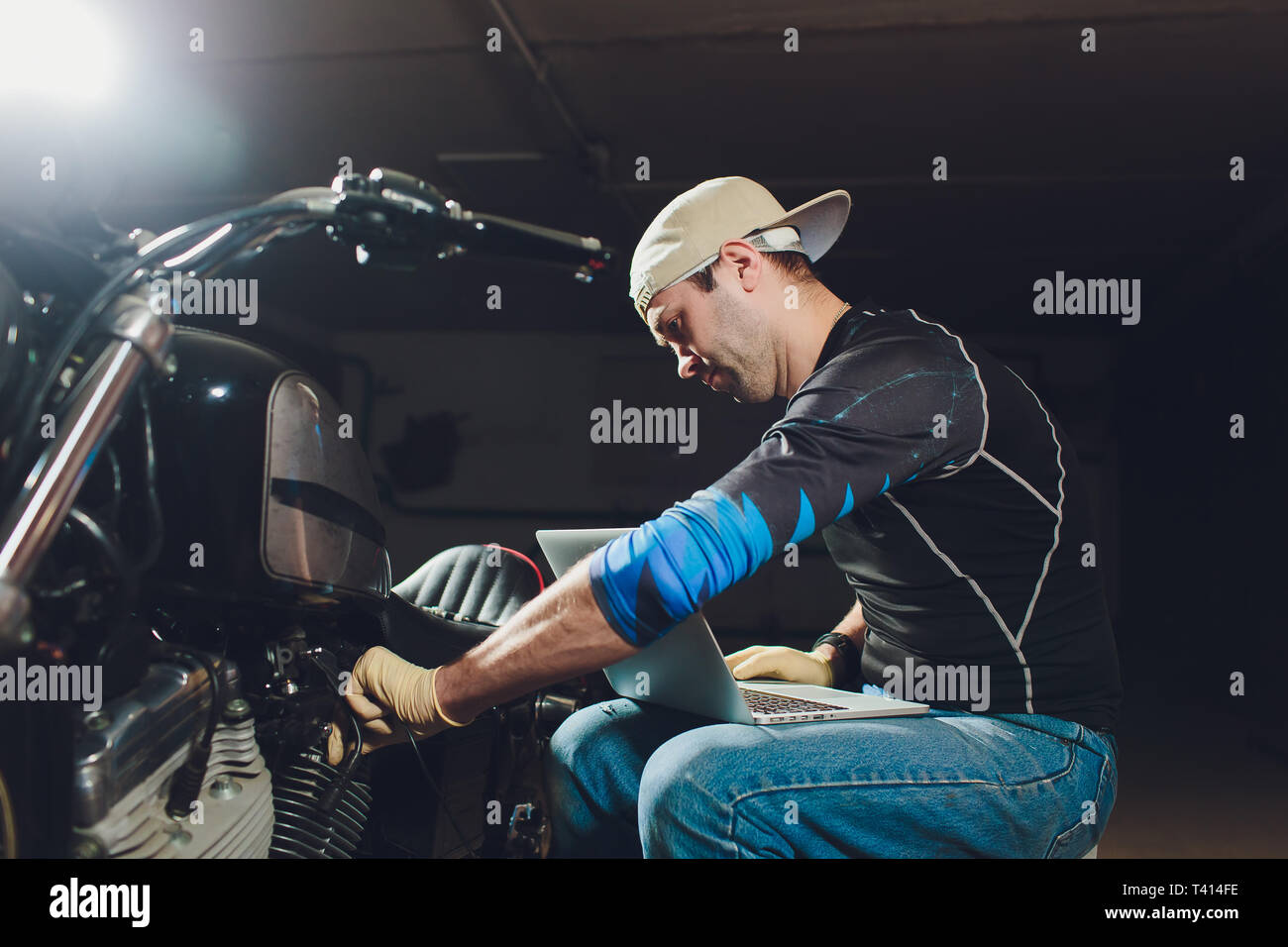 motorcycle mechanic repairing engine under supervisors guidance. video ...