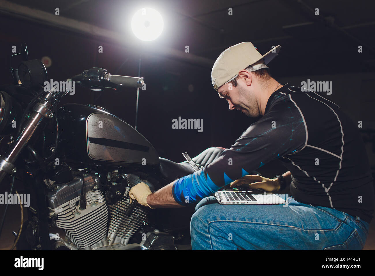 motorcycle mechanic repairing engine under supervisors guidance. video ...