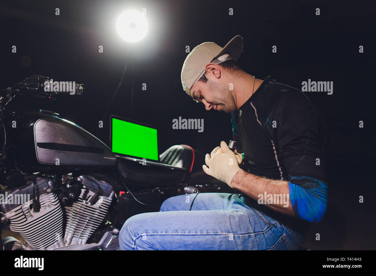 motorcycle mechanic repairing engine under supervisors guidance. video ...
