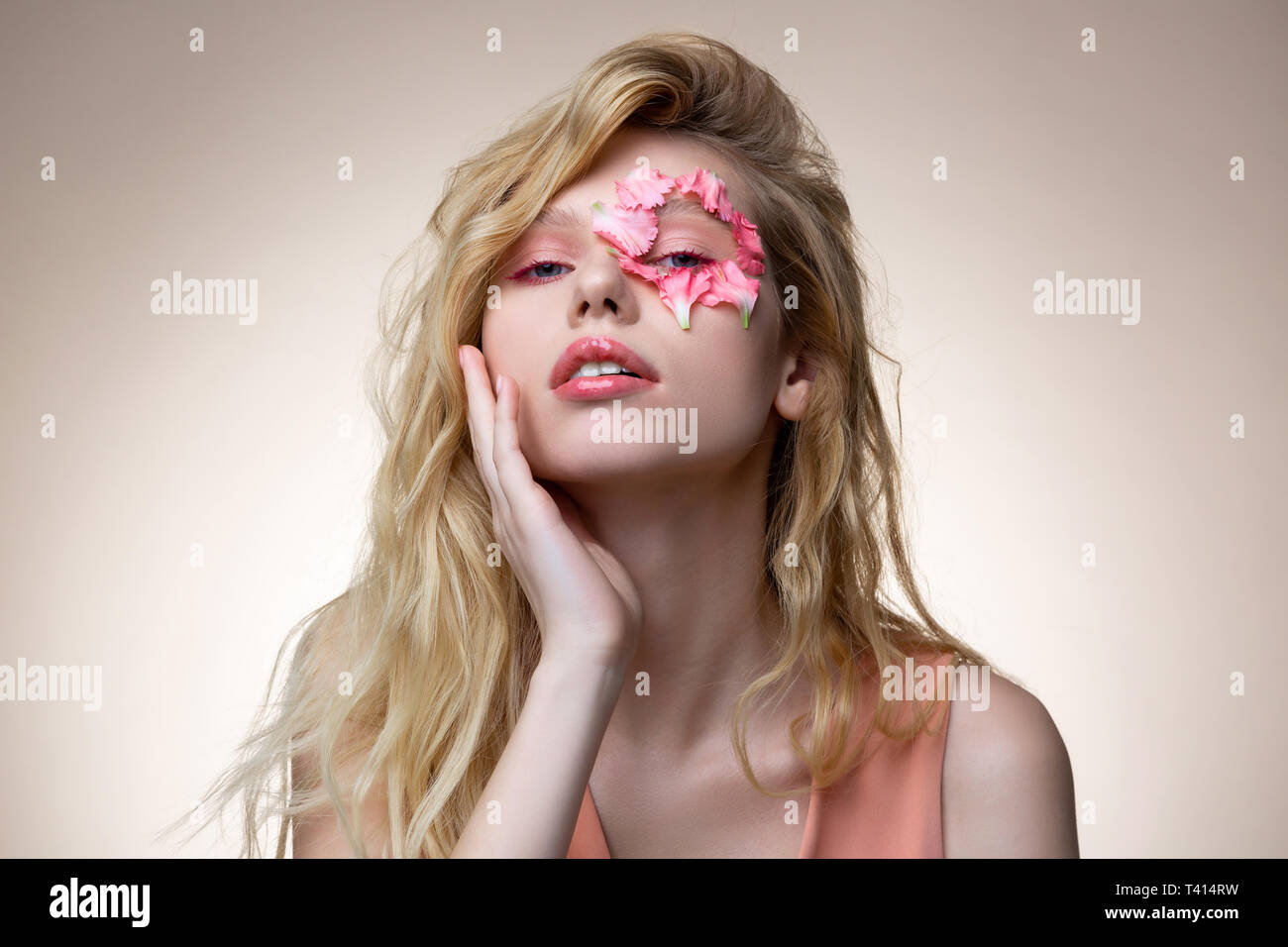 Female Blonde Hair Wearing Pink Stock Photos & Female Blonde Hair ...