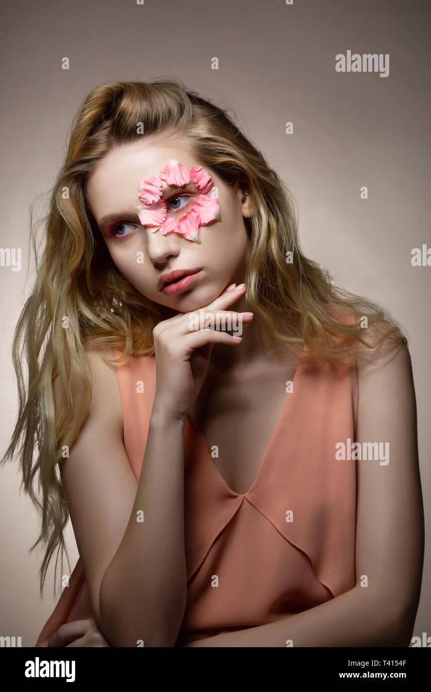 Model wearing nice light pink dress posing near background Stock Photo ...