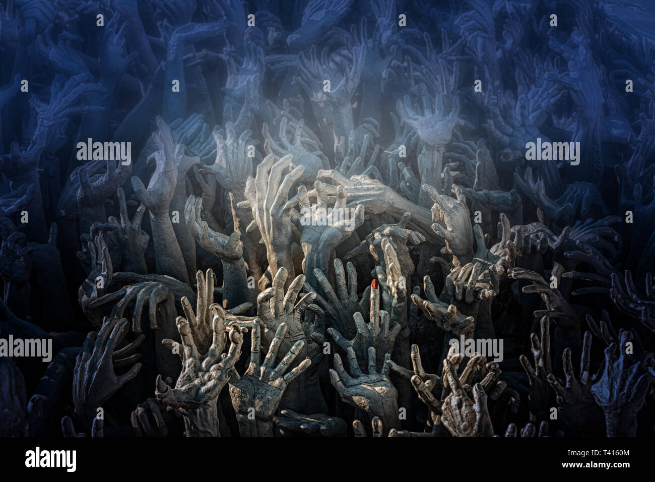 Hands reach up from the underworld Stock Photo - Alamy